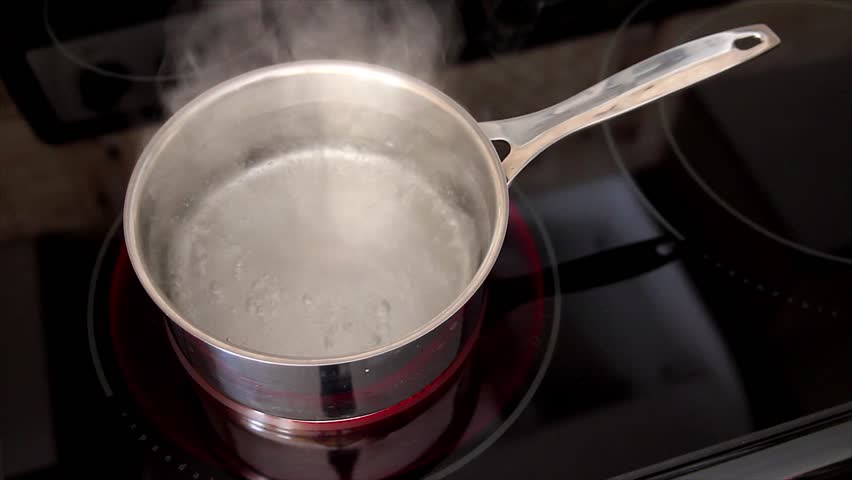 A Pot Of Boiling Water On The Stove (rapid Boil With Steam) Stock ...