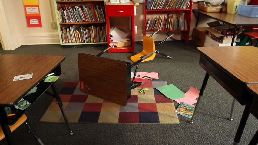 Shot of knocked-over desk and chair in classroom - HD stock video clip