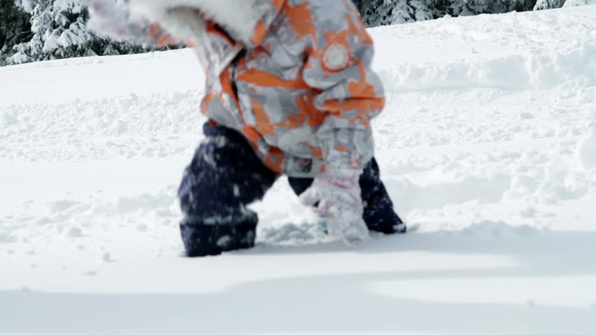 Little Girl Trudging Through Fresh Snow In Winter Stock Footage Video ...