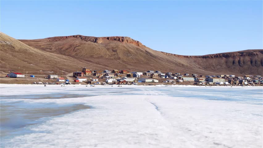 Landscape Of Arctic Bay, Nunavut Shot From The Sea-ice. (Pan Right ...