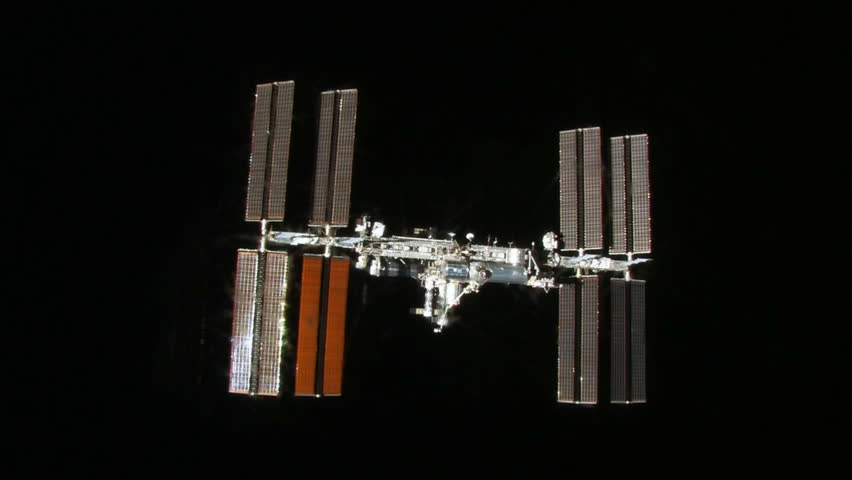 CIRCA 2010s - The International Space Station Flies Against A Black ...