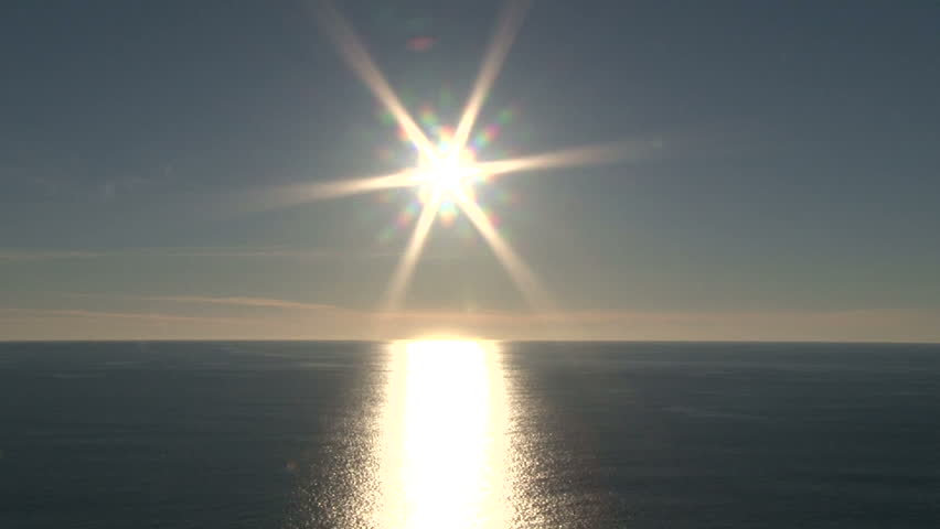 Close Up On Sun Rising Behind Pacific Ocean Horizon On Beautiful And ...