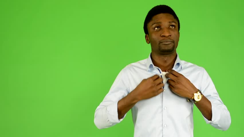 Young Handsome Black Man Adjusts Clothing And Smiles - Green Screen ...
